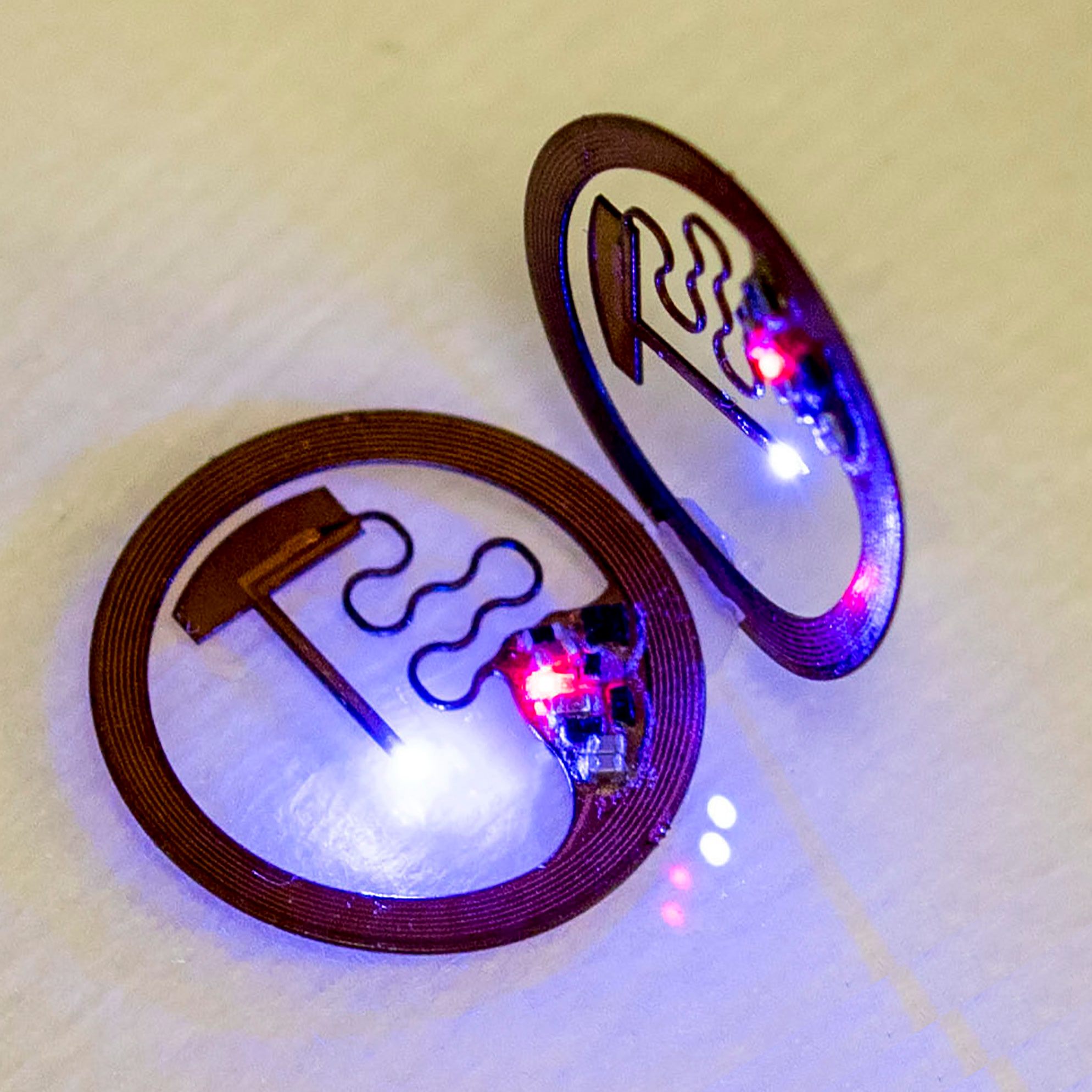 Battery-free and digitally controlled implantable light sources for ...